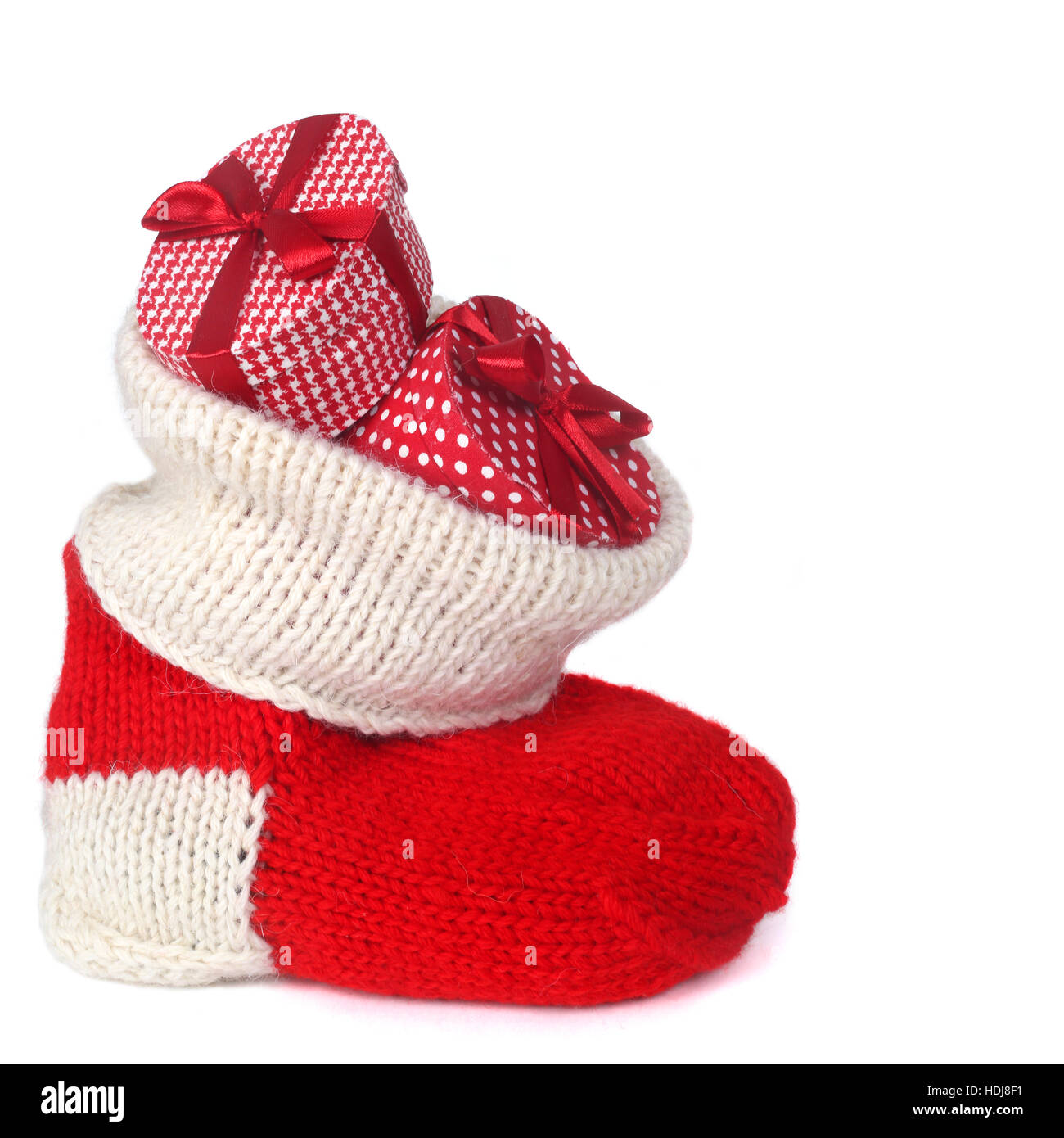 Red Christmas sock with gifts isolated on white background Stock Photo ...