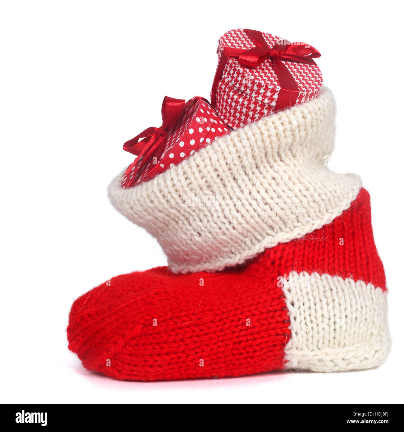 Red Christmas sock with gifts isolated on white background Stock Photo ...