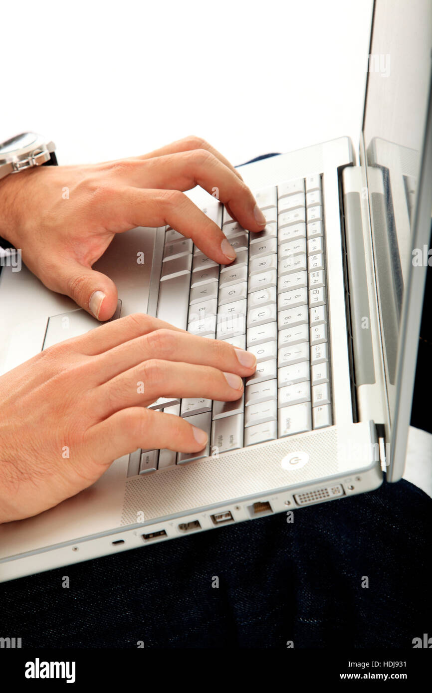 Young businessman holding laptop typing hi-res stock photography and ...