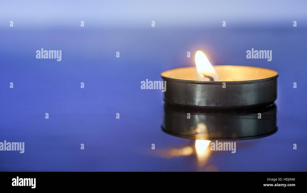 Scented candle light over blue hi-res stock photography and images - Alamy