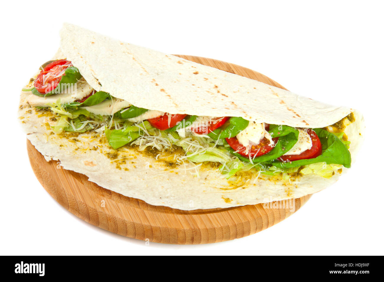 Delicious italian wrap on wooden plate isolated over white Stock Photo ...
