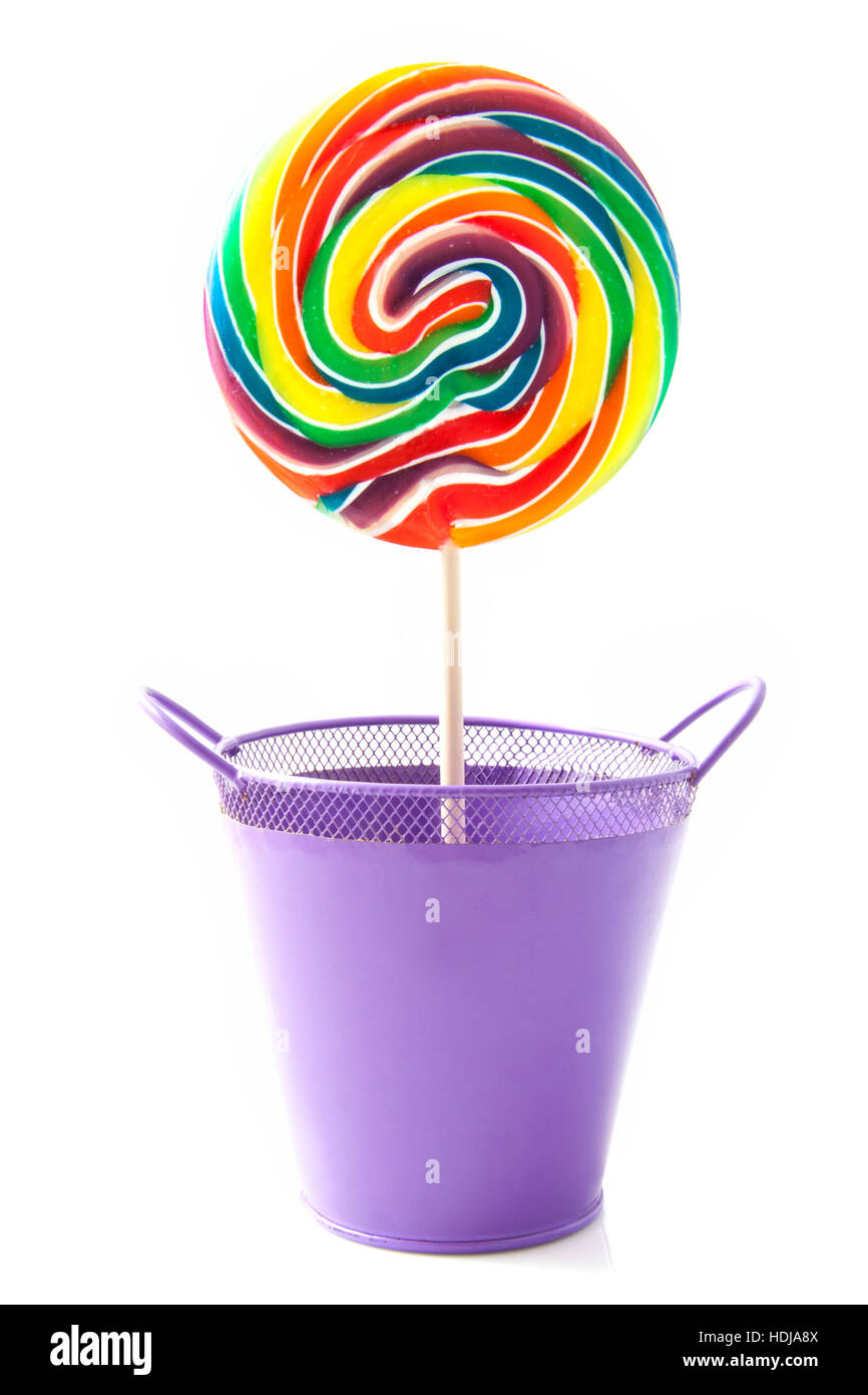 Colorful rainbow lollipop in purple flowerpot isolated over white Stock ...