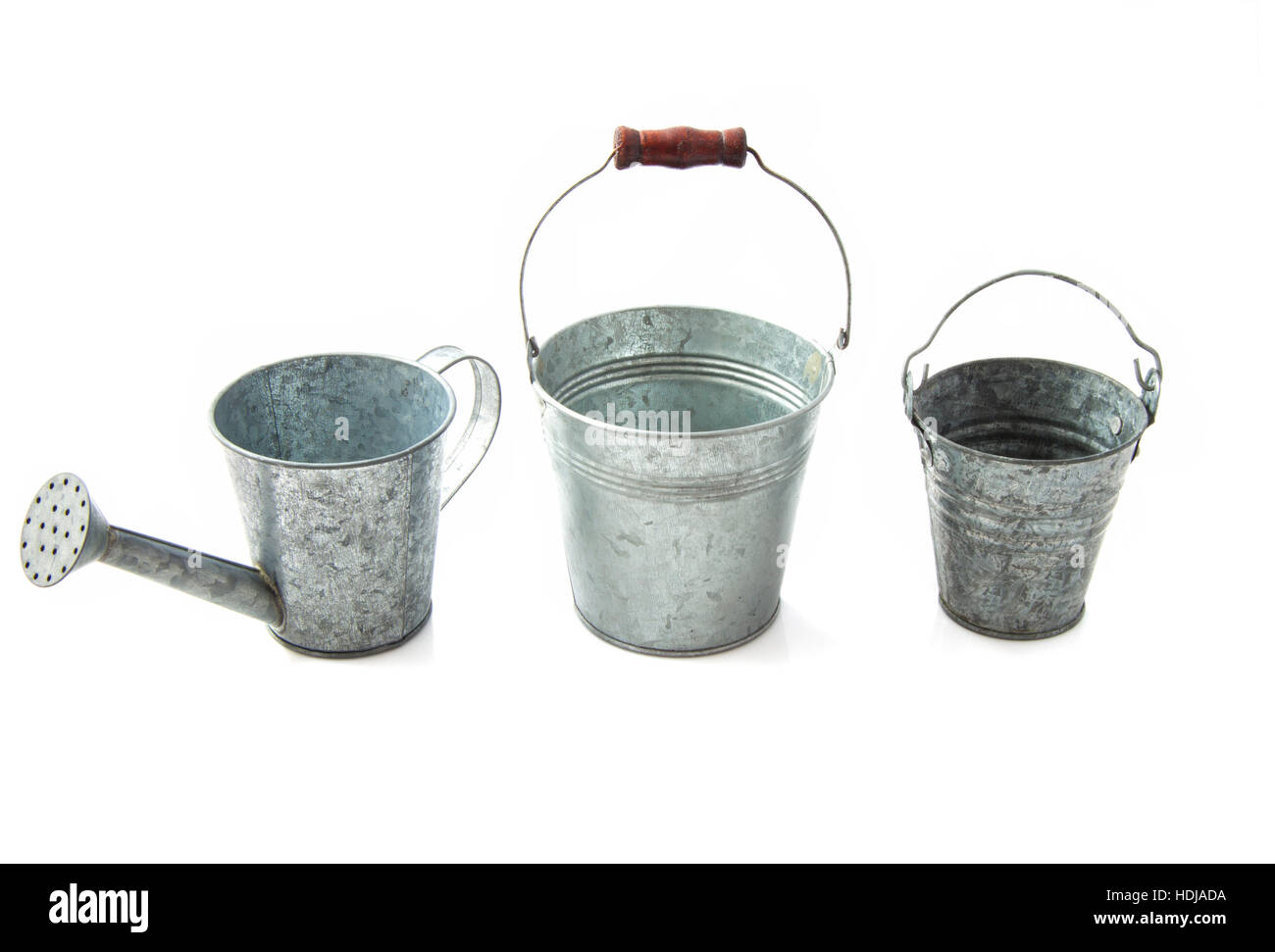Three zinc cans in a row isolated over white Stock Photo - Alamy