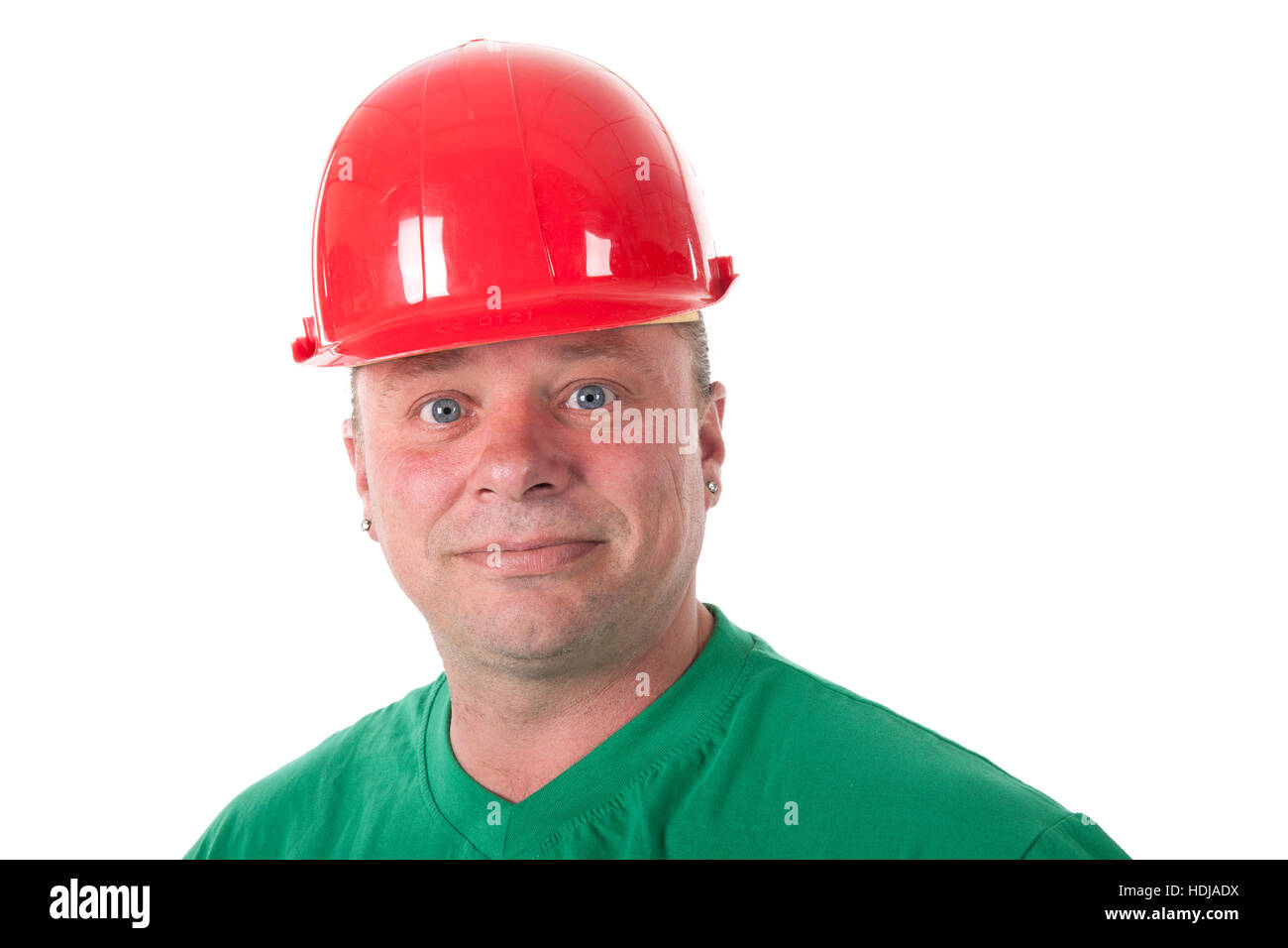 Young builder with helmet smiling on a white background Stock Photo - Alamy