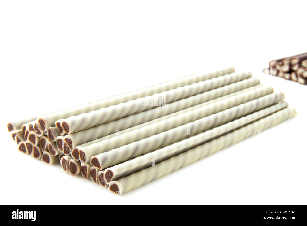 Brown and white filled chocolate sticks for background use Stock Photo ...