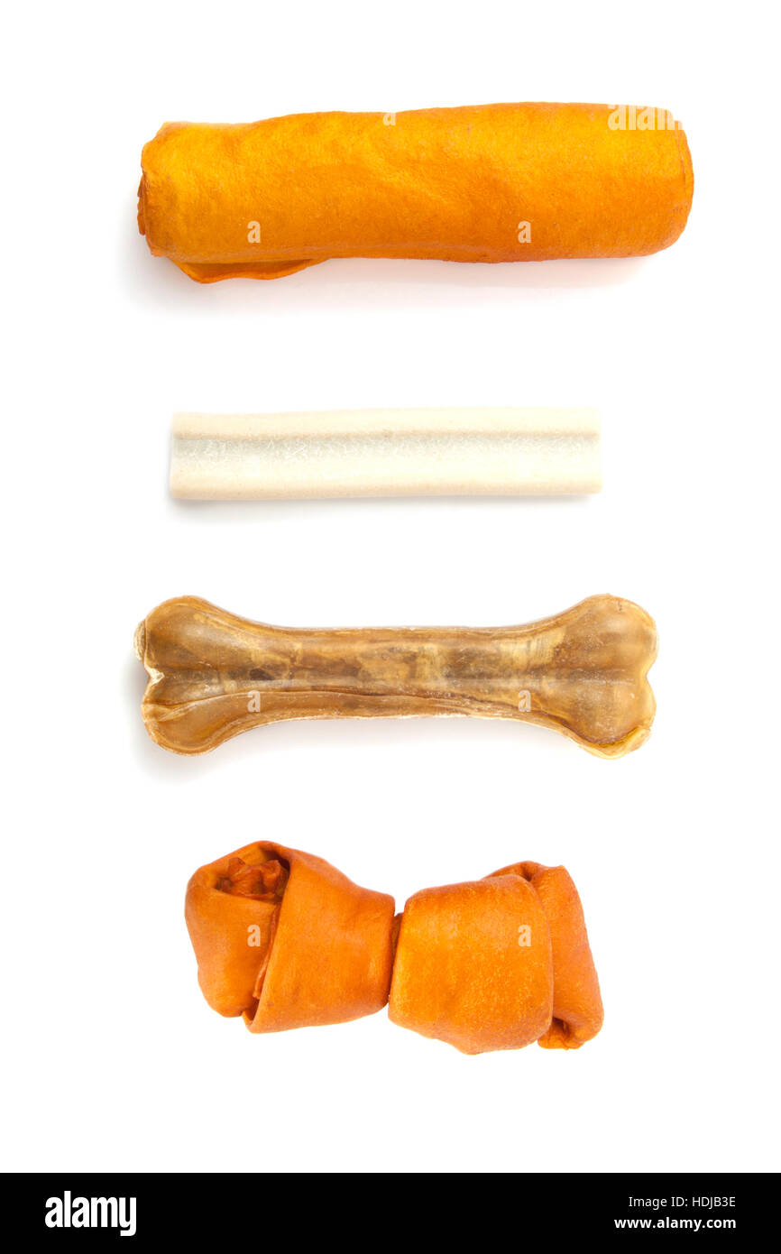 Dog bones in a row isolated over white Stock Photo - Alamy