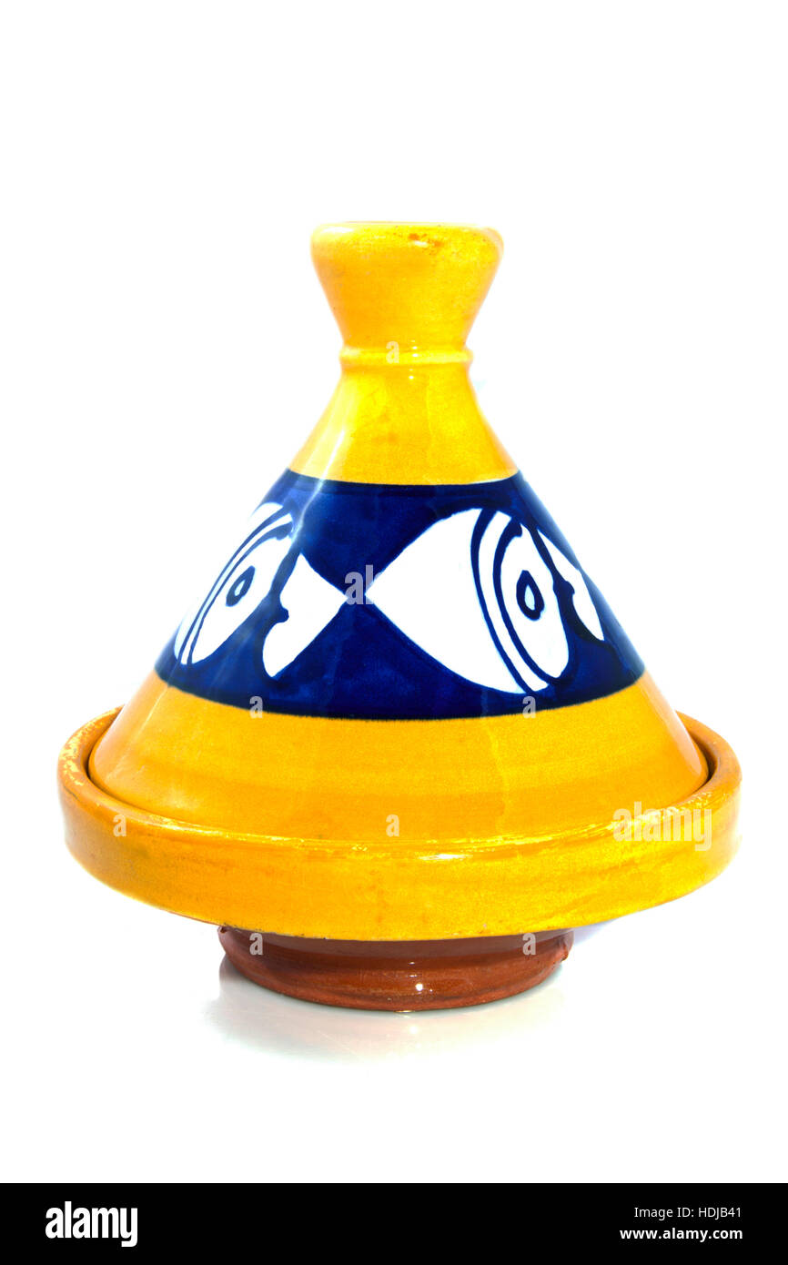 Handmade tajine with yellow and blue colors isolated over white Stock ...