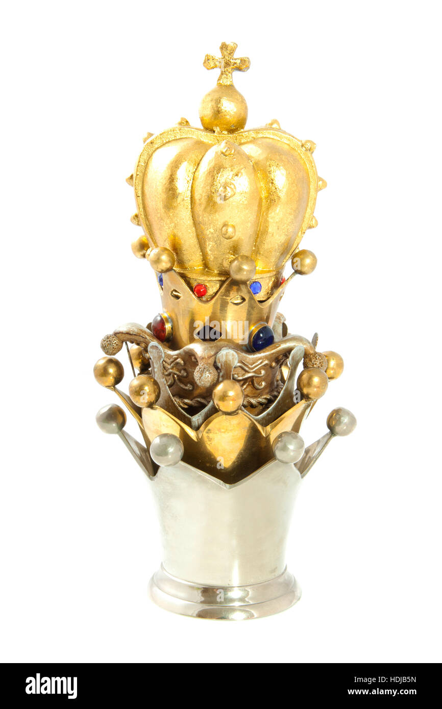 Golden and silver crowns on a pile isolated over white Stock Photo - Alamy