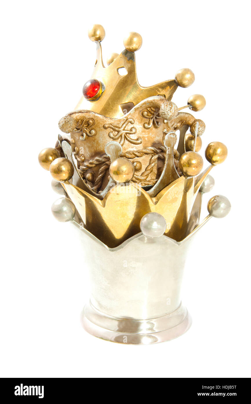 Golden and silver crowns on a pile isolated over white Stock Photo - Alamy