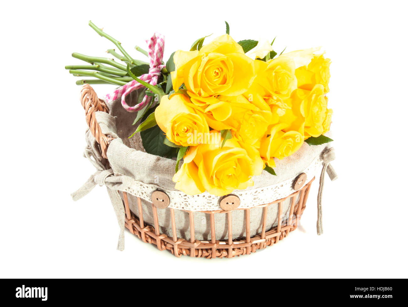 Yellow bouquet roses in basket with jute isolated over white Stock ...
