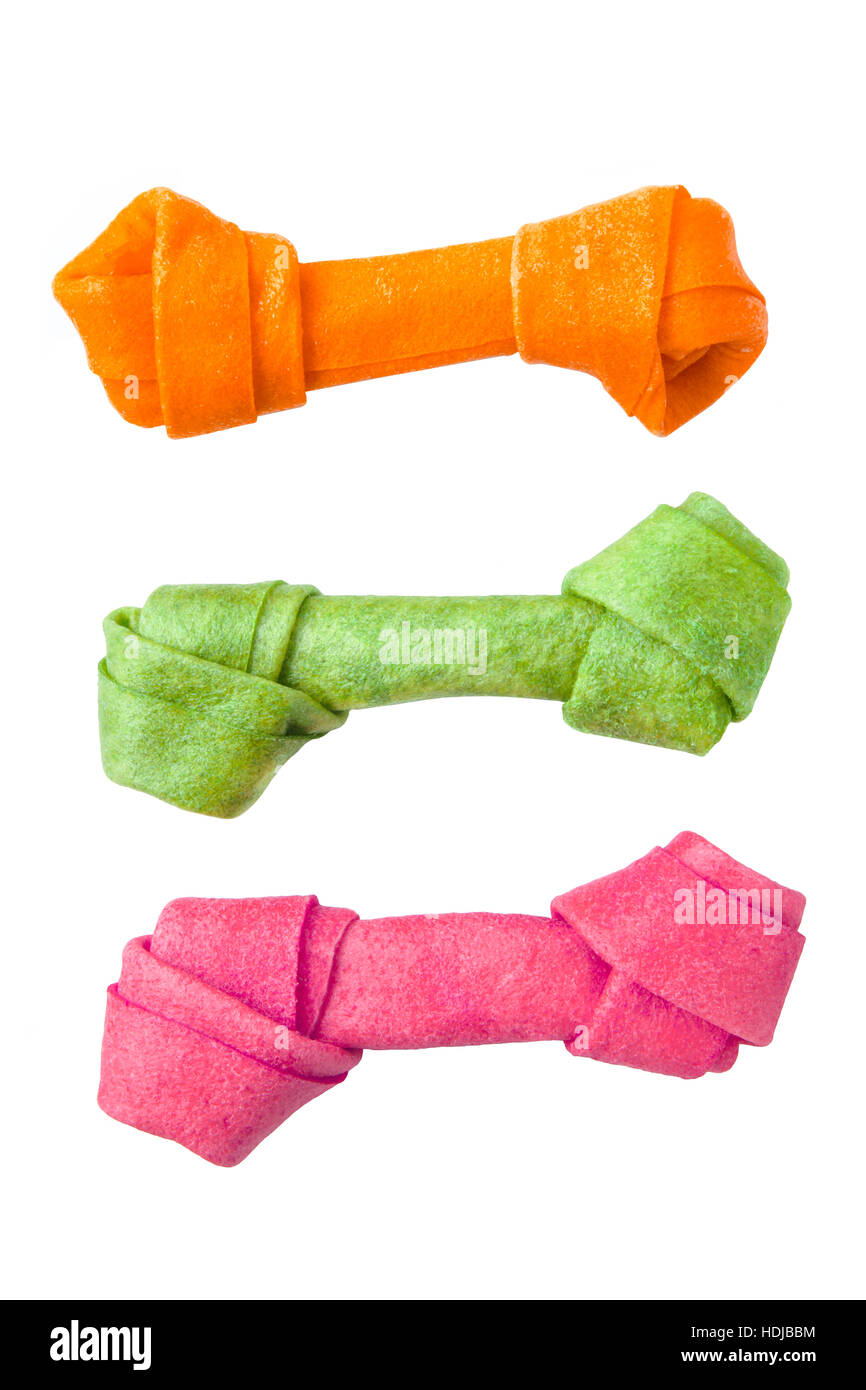 Three colorful bones isolated over white Stock Photo - Alamy