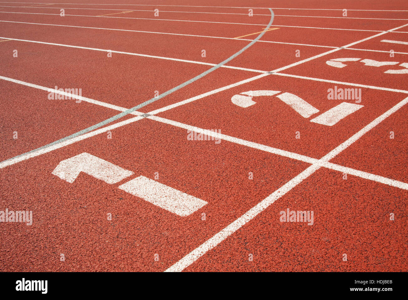 Numbers on a red athletic running track Stock Photo - Alamy