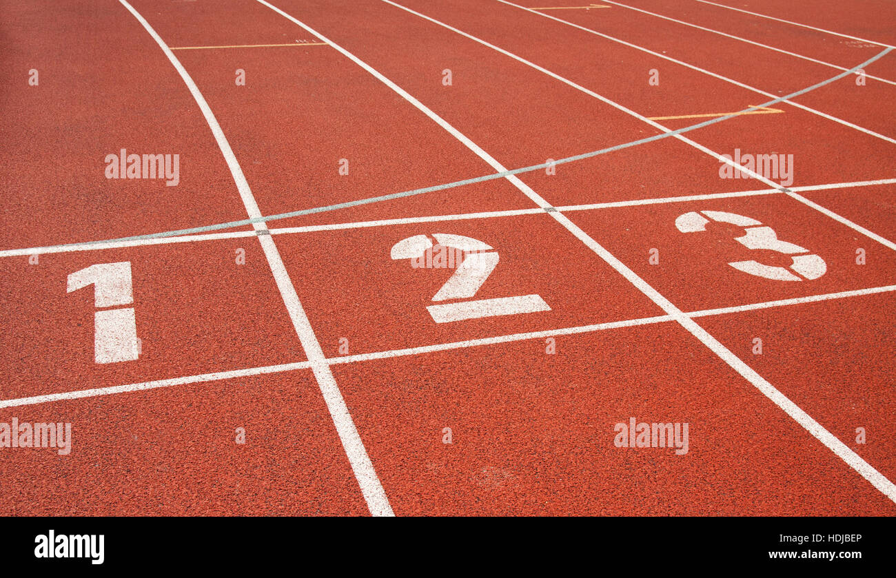 Numbers on a red athletic running track Stock Photo - Alamy