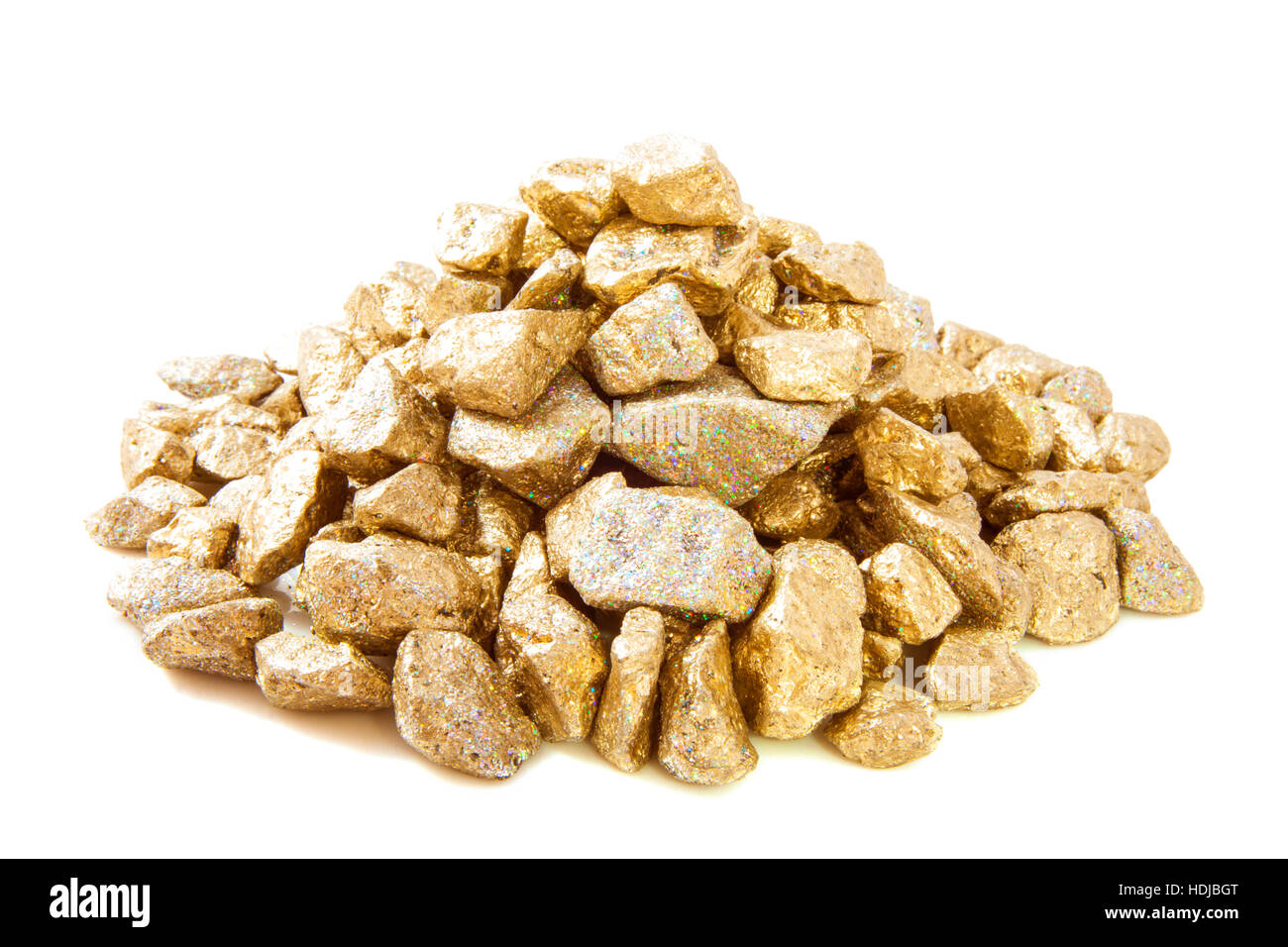 Pile golden stones closeup isolated over white Stock Photo - Alamy