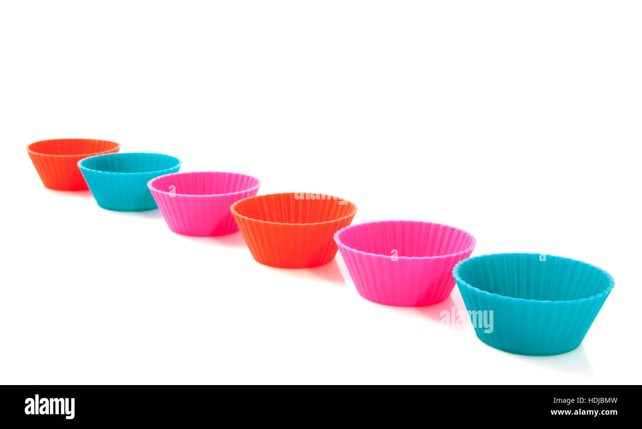 Six colorful cups in a row isolated over white Stock Photo - Alamy