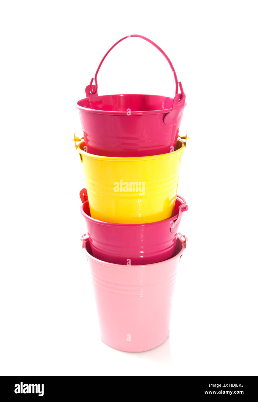 Four colorful buckets on a pile isolated over white Stock Photo - Alamy