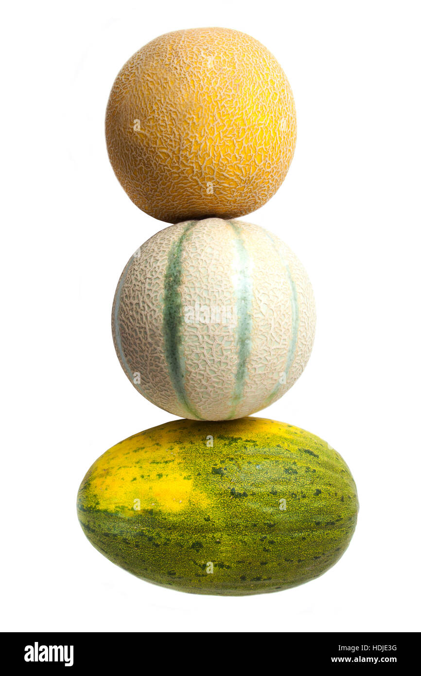 Three melons on a pile isolated over white Stock Photo - Alamy