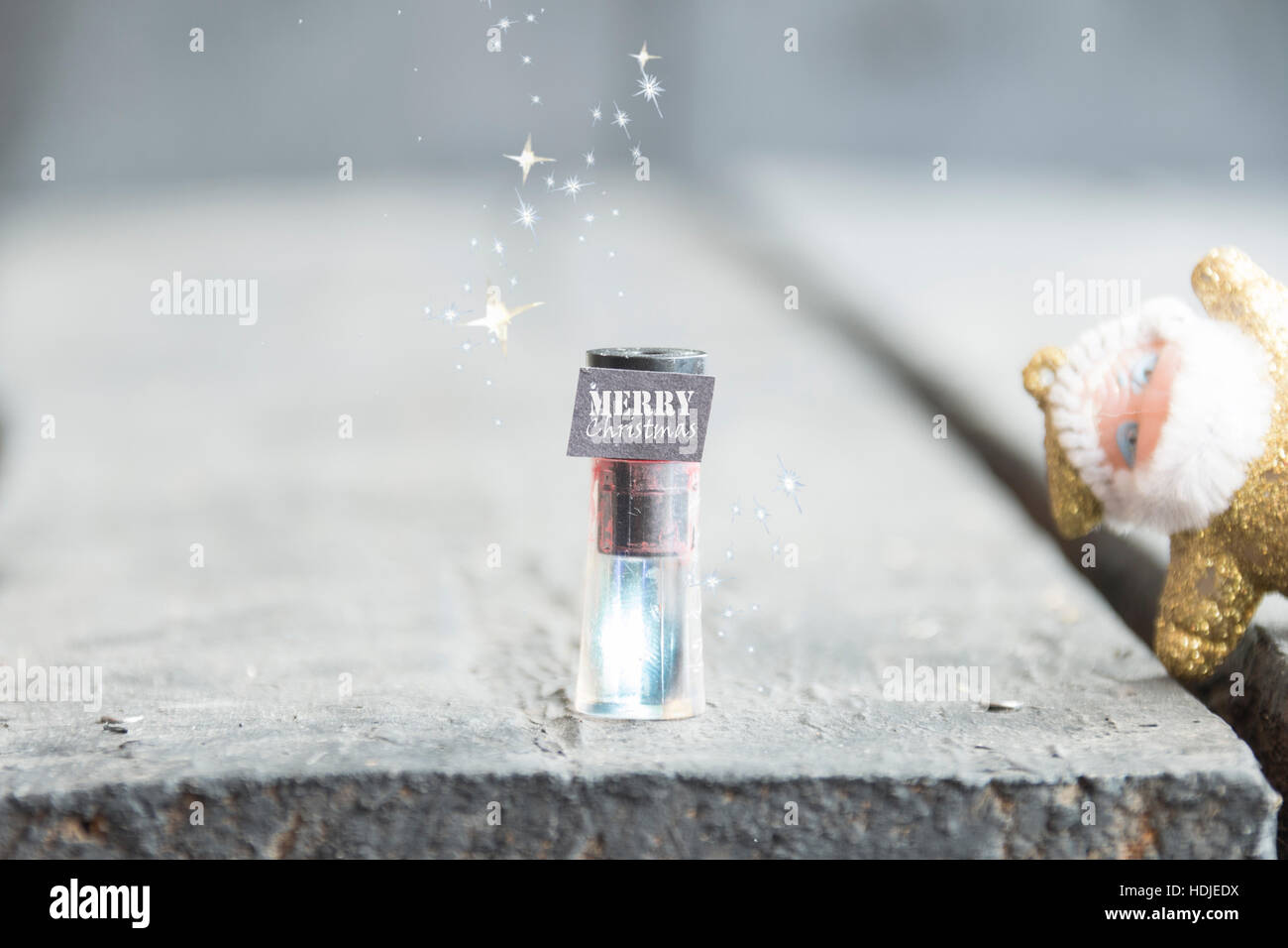 Merry Christmas tag and golden santa Stock Photo - Alamy