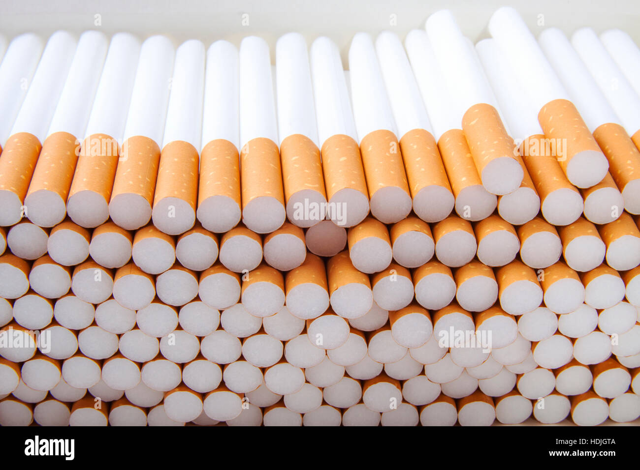 Pile sigarettes close-up for background use Stock Photo - Alamy