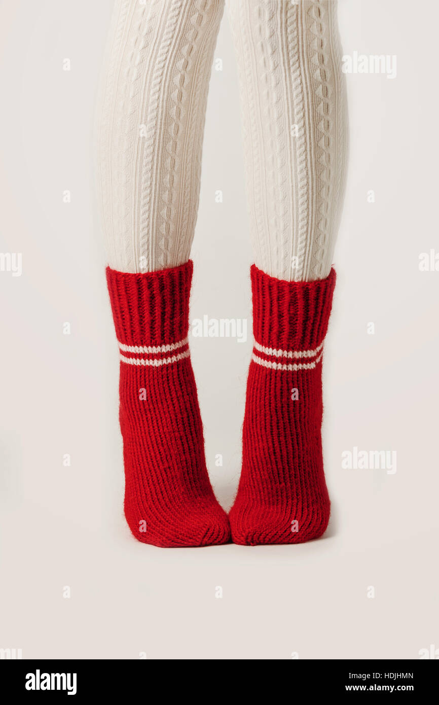 Female legs in white stockings and red knit socks Stock Photo - Alamy