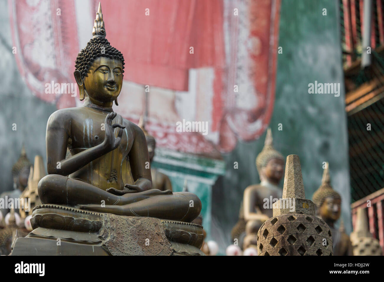 Row of Buddha statues at Ganagarama temple, Colombo, Sri Lanka Stock ...