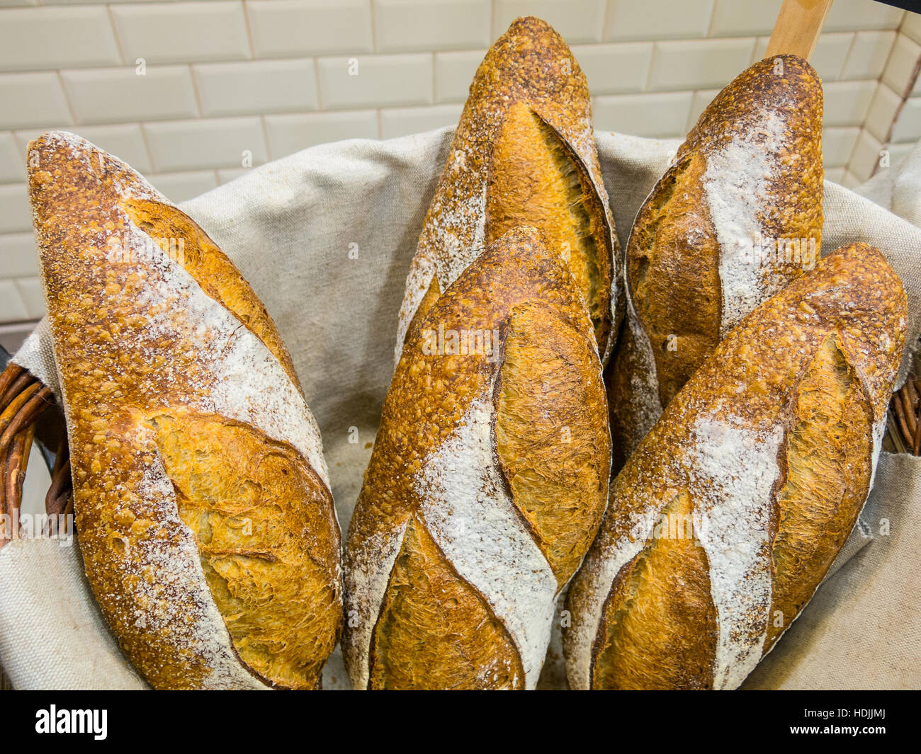 Delicious bread in a basket at a bakery Stock Photo - Alamy
