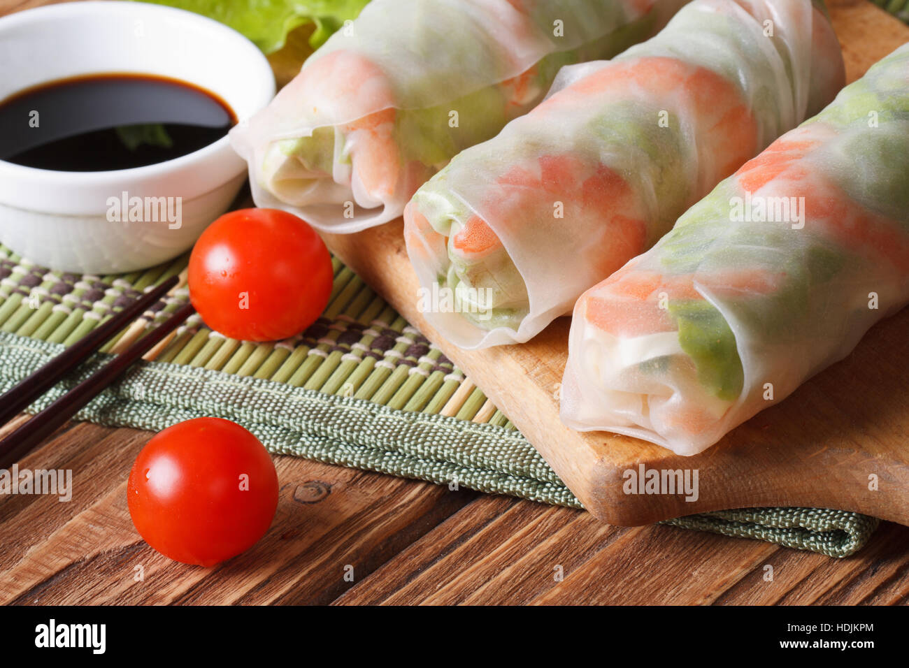 Korean spring rolls with shrimp and sauce close up on the table ...