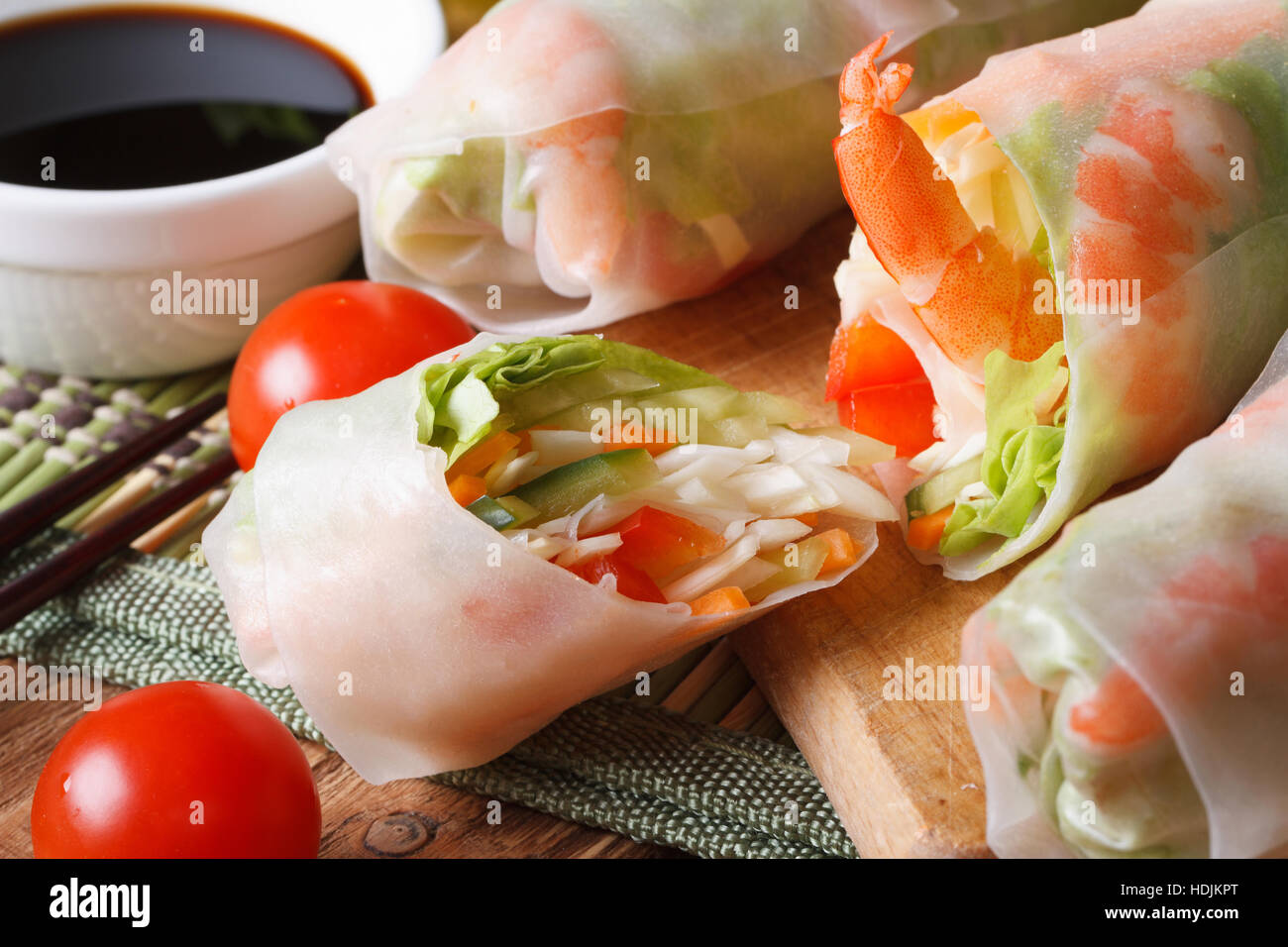 sliced the spring rolls with shrimp, vegetables and sauce close up on ...