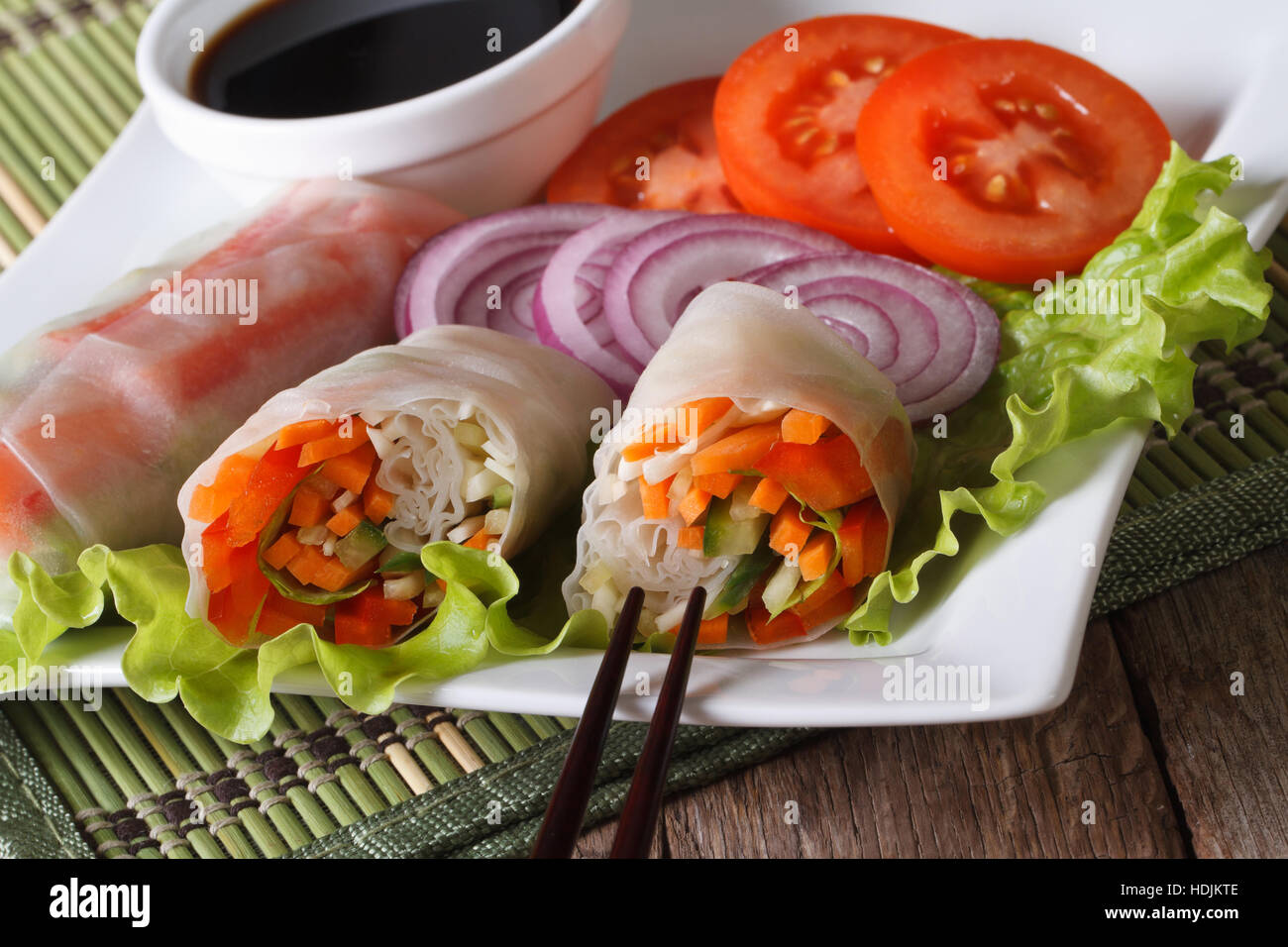 Vietnamese vegetable spring rolls with sauce on a plate close-up ...