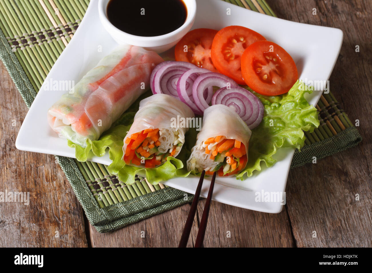 Vietnamese vegetable spring rolls with sauce on a plate close-up ...