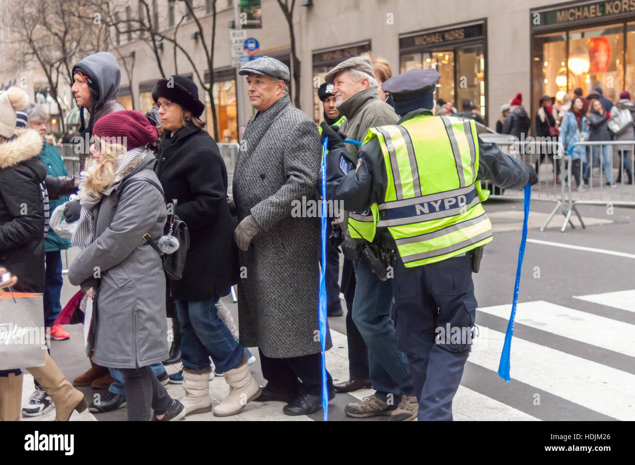 NYPD officers corral pedestrians for crowd control at intersections on ...