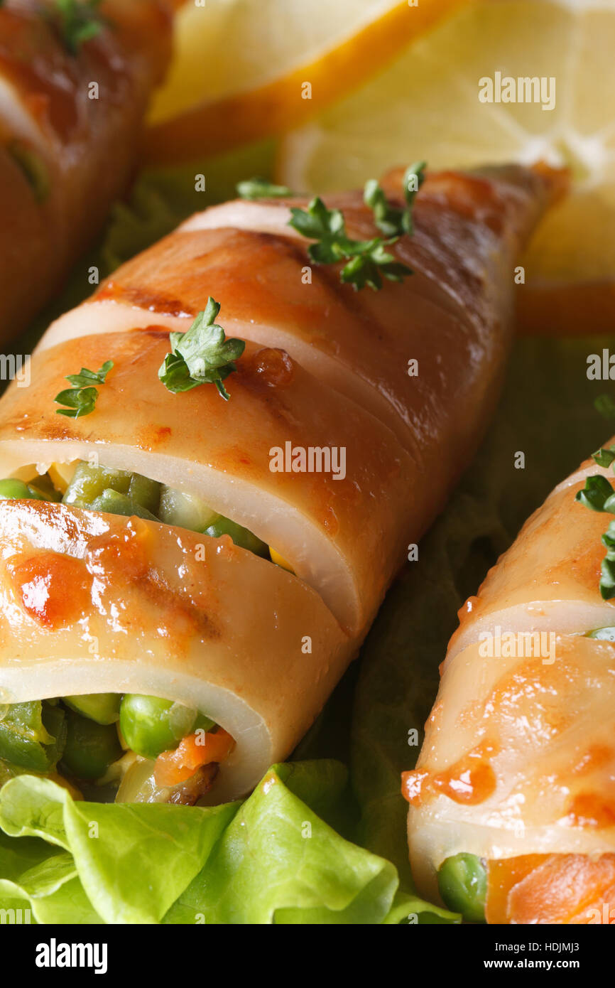 Fried squid stuffed with vegetables macro on lettuce. Vertical Stock ...