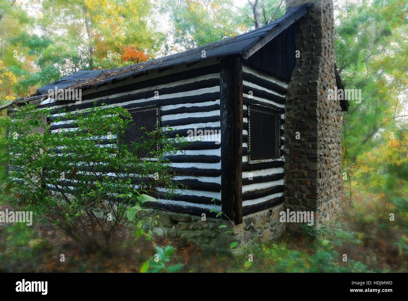 Log cabin in woods beside railroad tracks, Chester, Virginia USA. Orton ...
