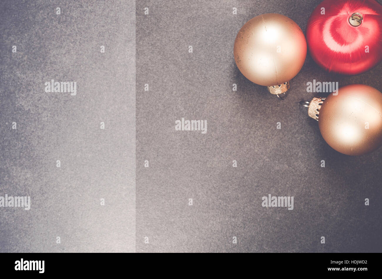 Christmas balls ornament on a stone surface - top view Stock Photo - Alamy