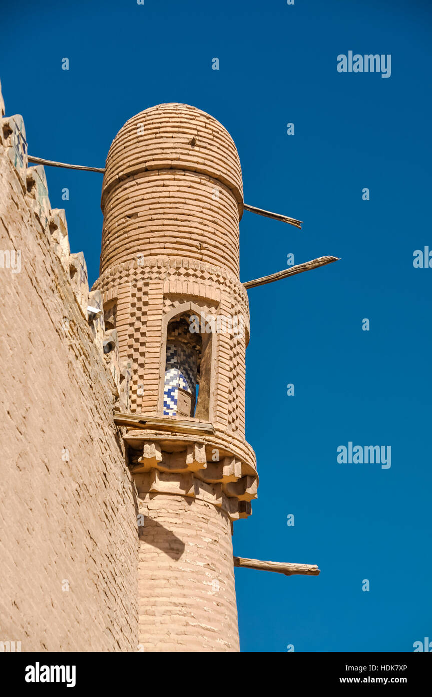 Photo of tower made of bricks with painted ornaments inside in Khiva in ...
