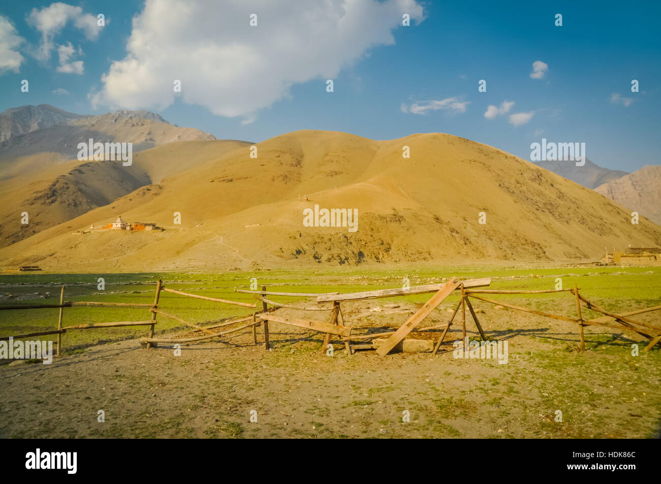 Panoramic photo of empty countryside with greenery and wooden fence in ...
