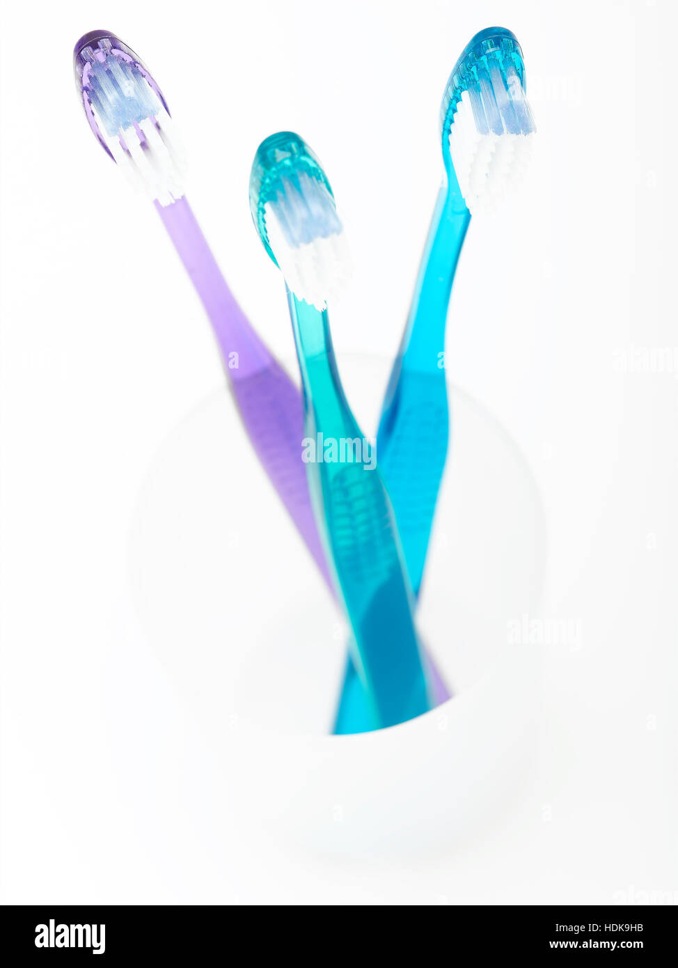 Tooth brushes in cup hi-res stock photography and images - Alamy