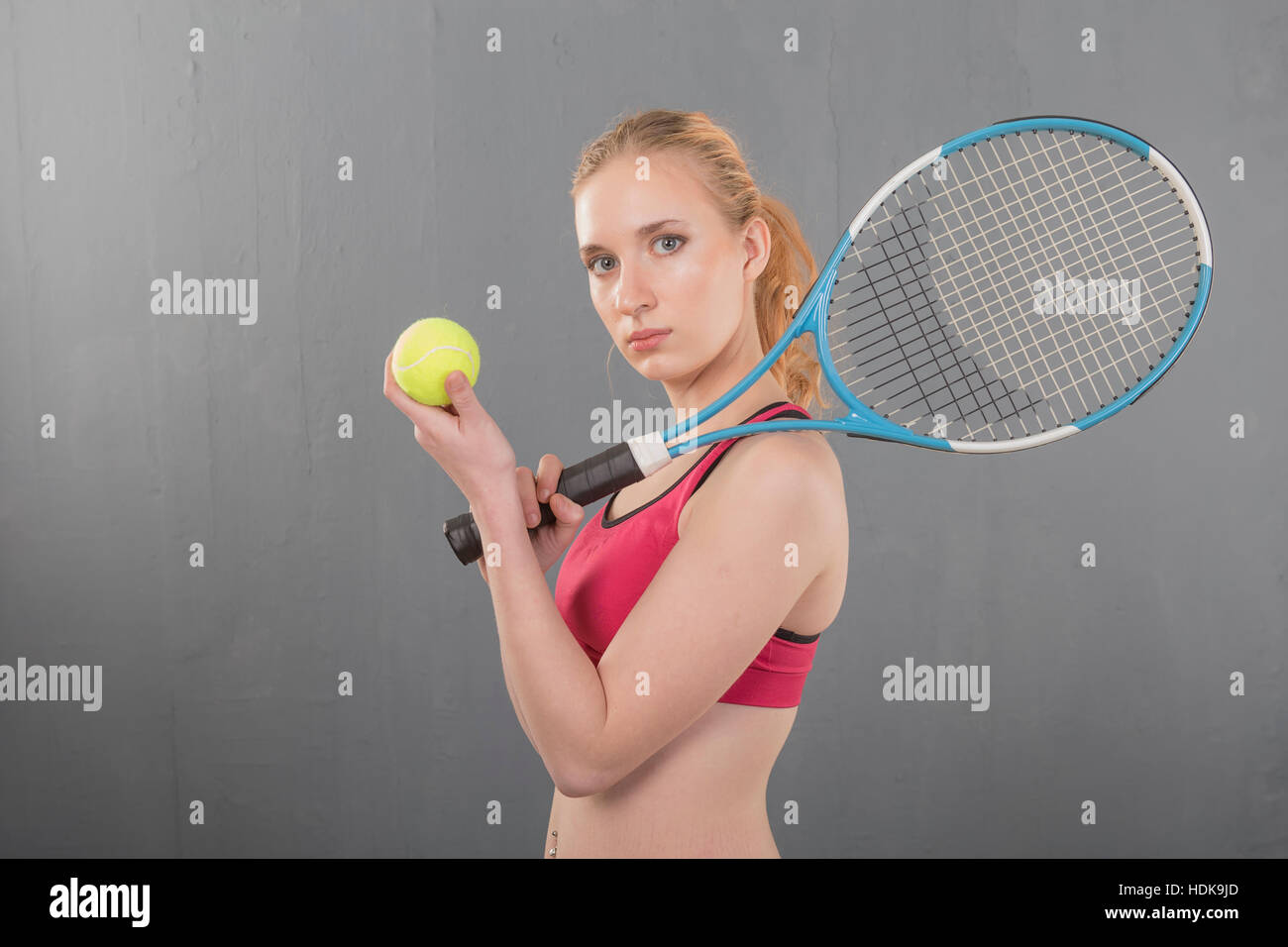 An attractive girl with a tennis racket Stock Photo - Alamy