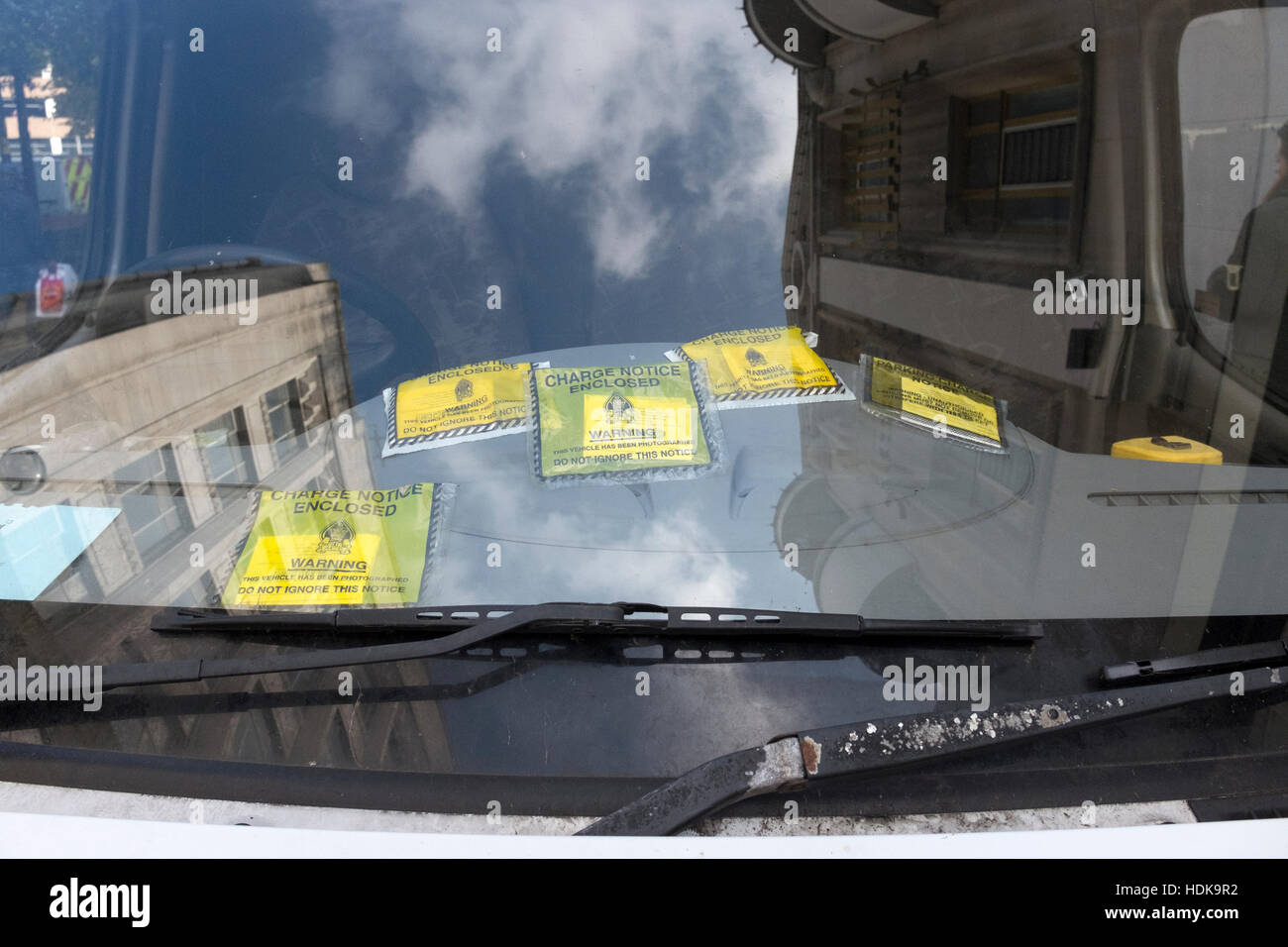 Car Van dashboard with several parking tickets Stock Photo - Alamy