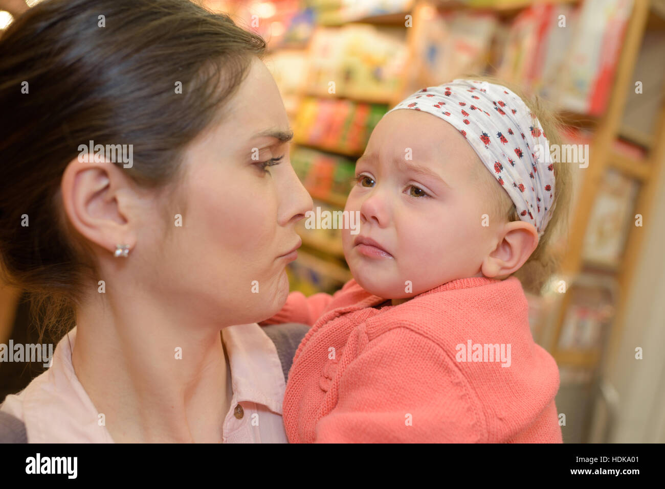 Mother comforting crying child hi-res stock photography and images - Alamy