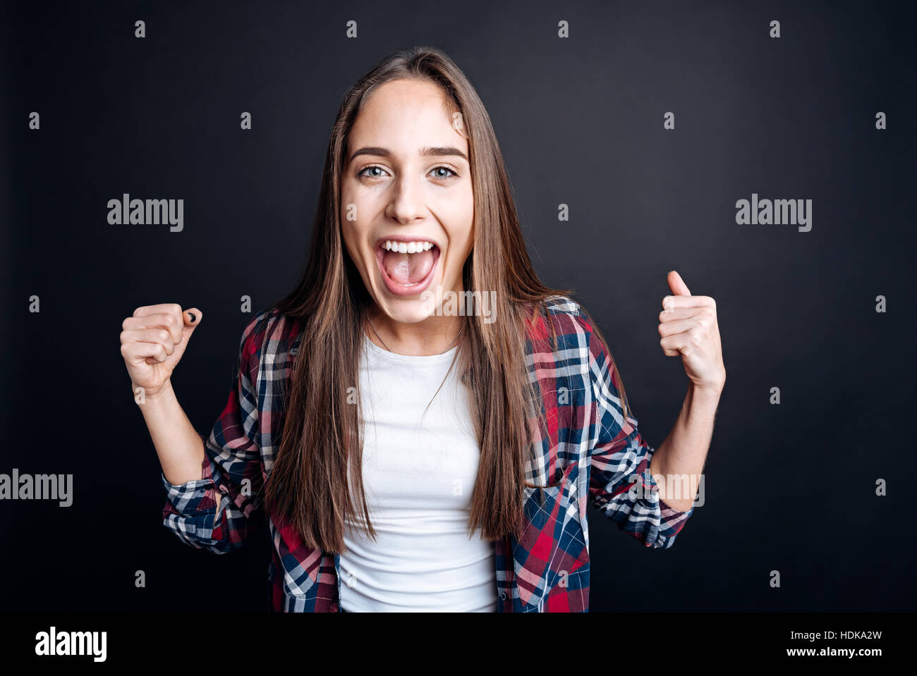 Cheerful woman expressing joy Stock Photo - Alamy