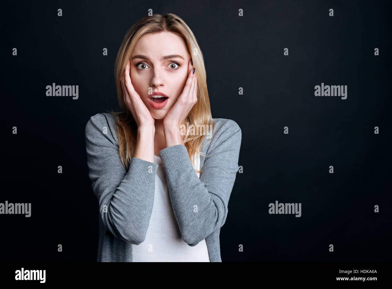 Pleasant young woman expressing wonder Stock Photo - Alamy