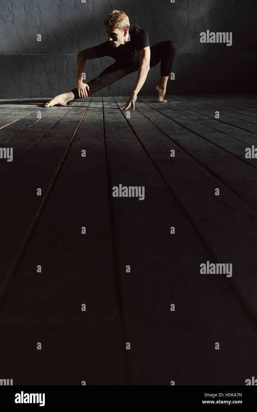 Flexible young dancer stretching in the studio Stock Photo - Alamy