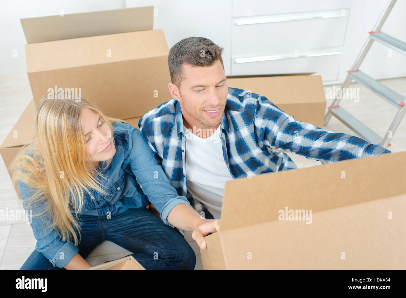 man and woman with boxes Stock Photo - Alamy