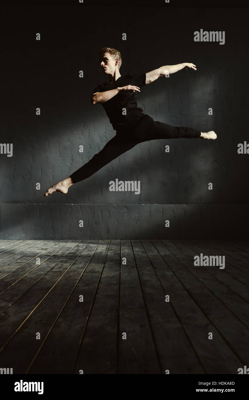 Involved ballet dancer stretching in the air Stock Photo - Alamy