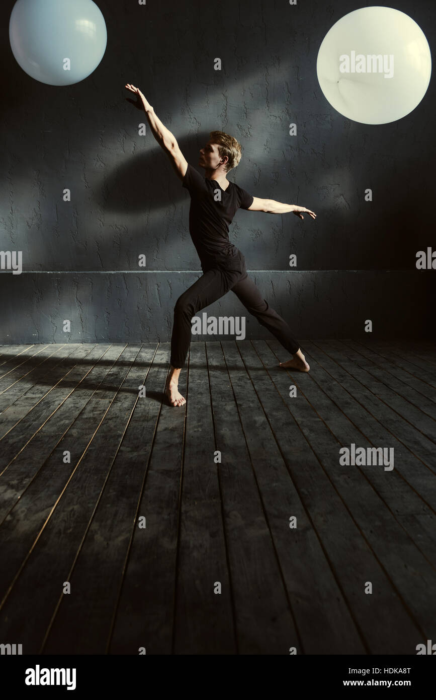 Graceful ballet dancer performing in the decorated studio Stock Photo ...
