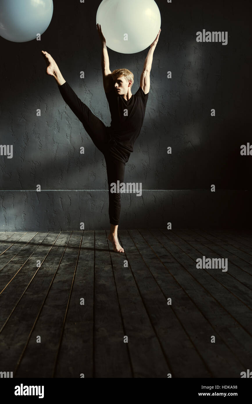 Concentrated young man dancing in the studio Stock Photo - Alamy