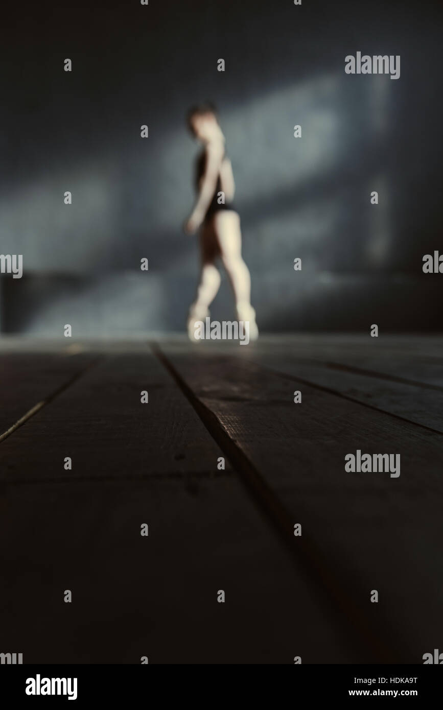 Slim ballet dancer standing on the tiptoes in the studio Stock Photo ...