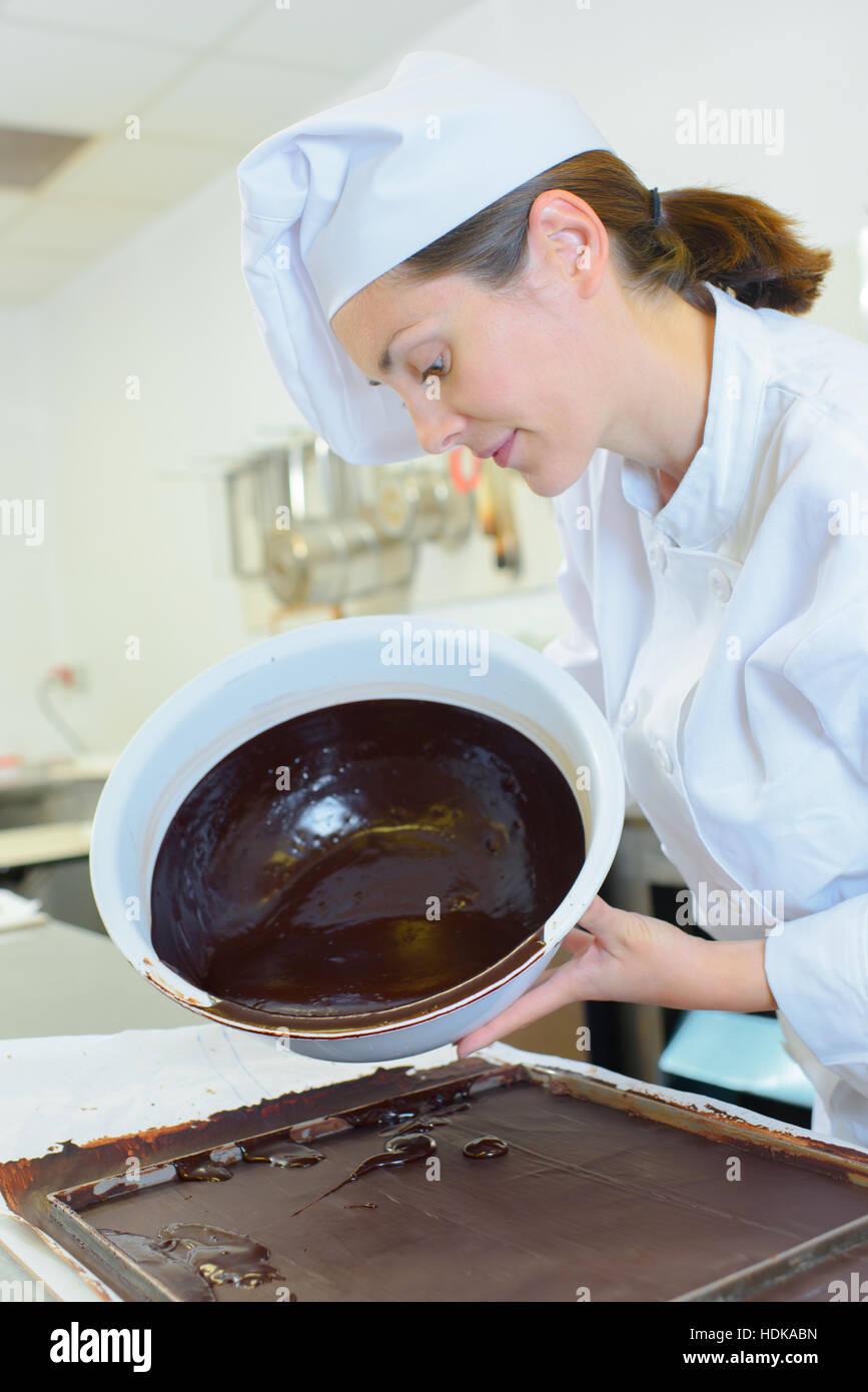 Chef pouring melted chocolate Stock Photo - Alamy