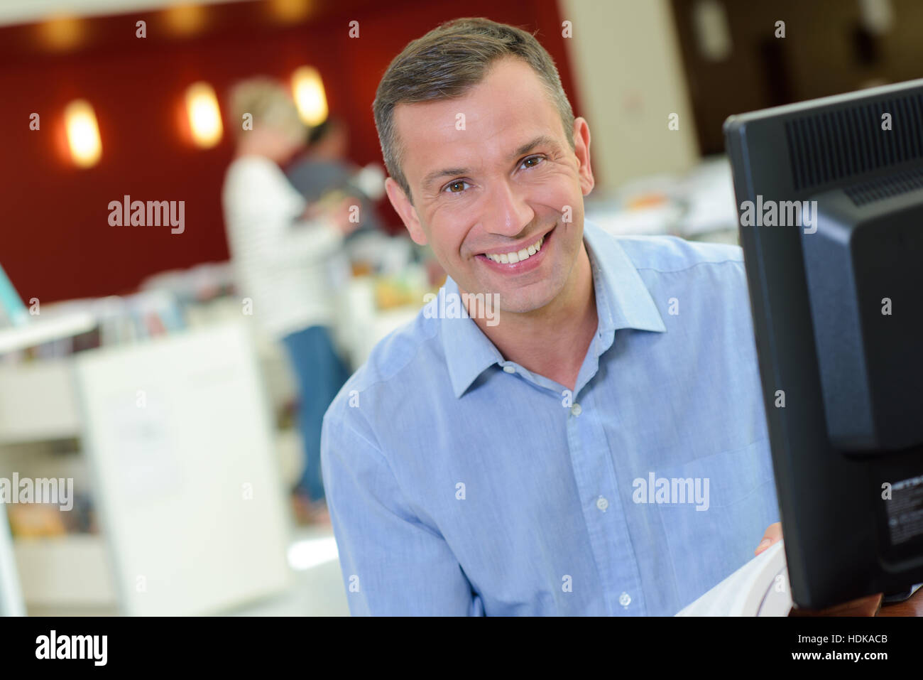 salesman in department store Stock Photo - Alamy